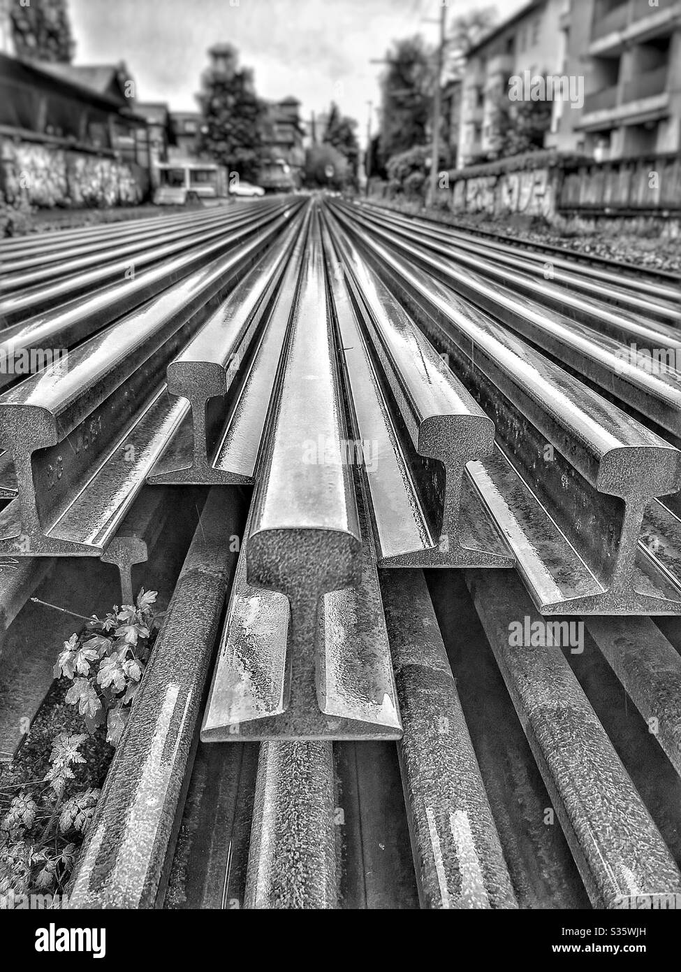 Railway track stacked and ready for laying Stock Photo - Alamy