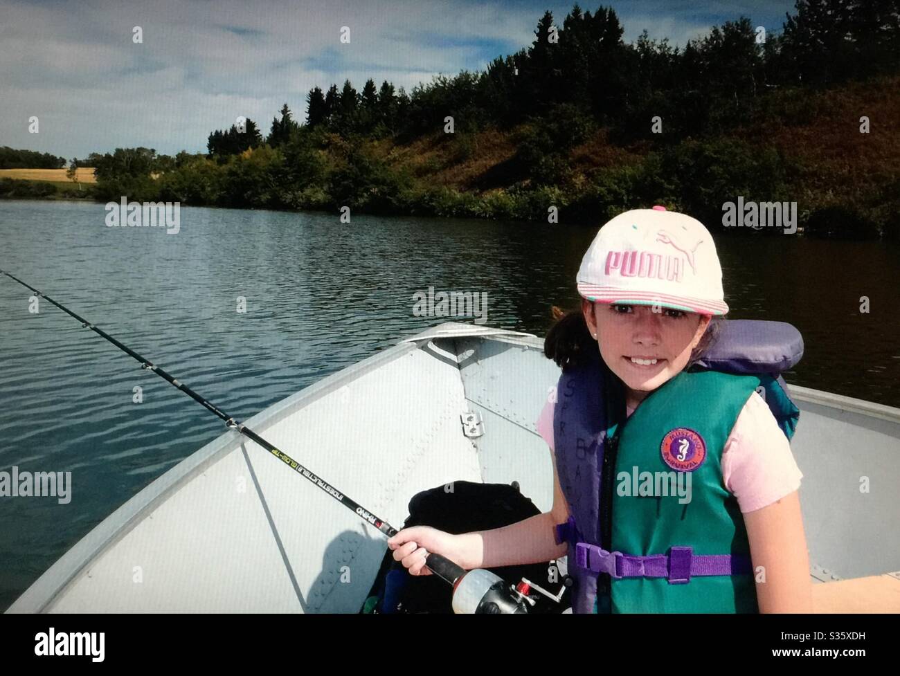 Family fun, Fishing on Pine Lake , Alberta, Canada, two sisters Stock ...