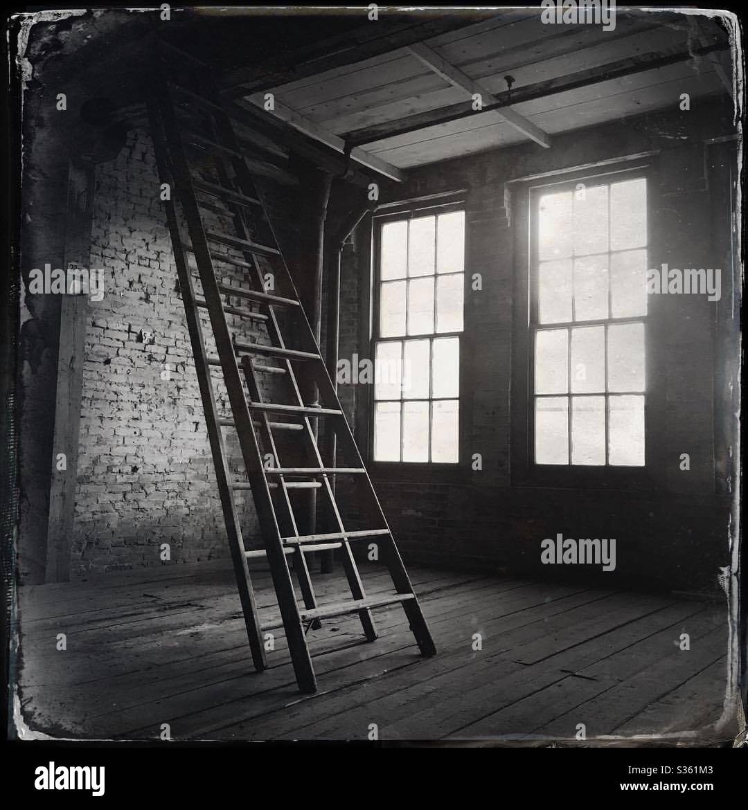 Ladder in warehouse Stock Photo - Alamy