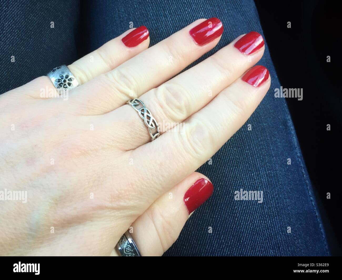 Hand red nail varnish hi-res stock photography and images - Alamy