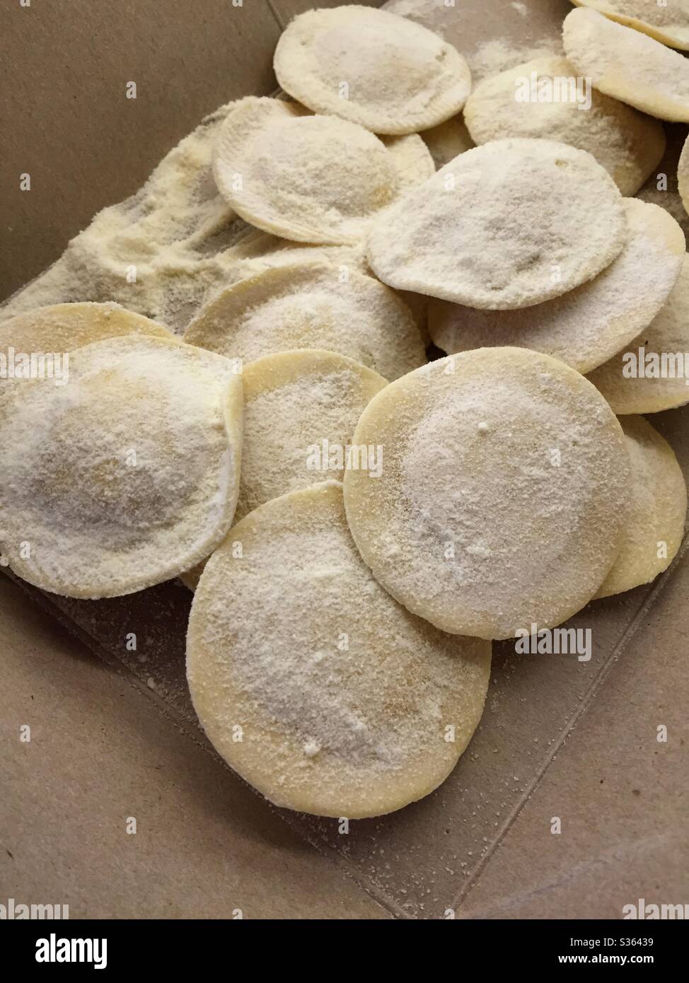 Fresh raw ravioli delivered from an Italian market Stock Photo - Alamy