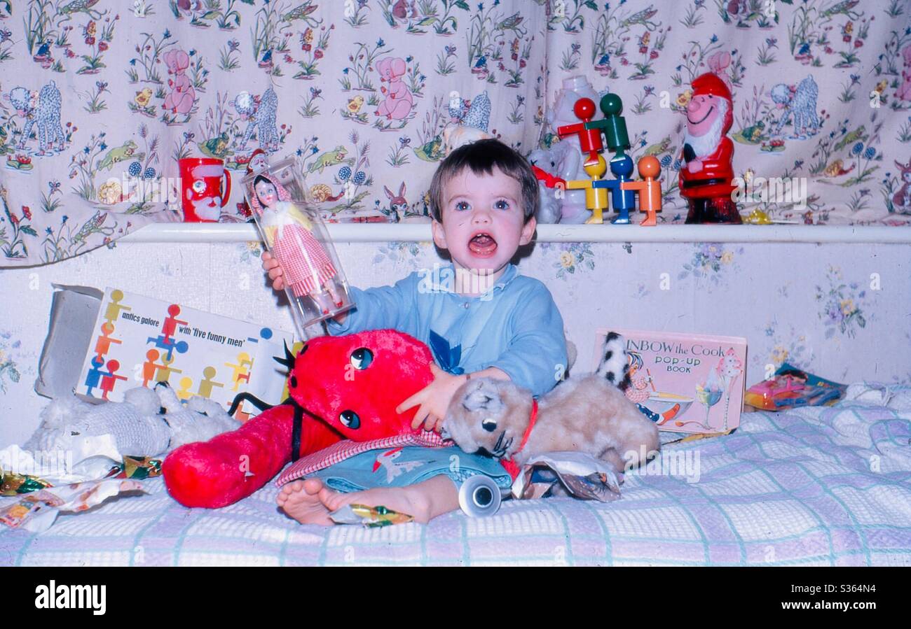 Christmas morning for a child opening presents Stock Photo - Alamy