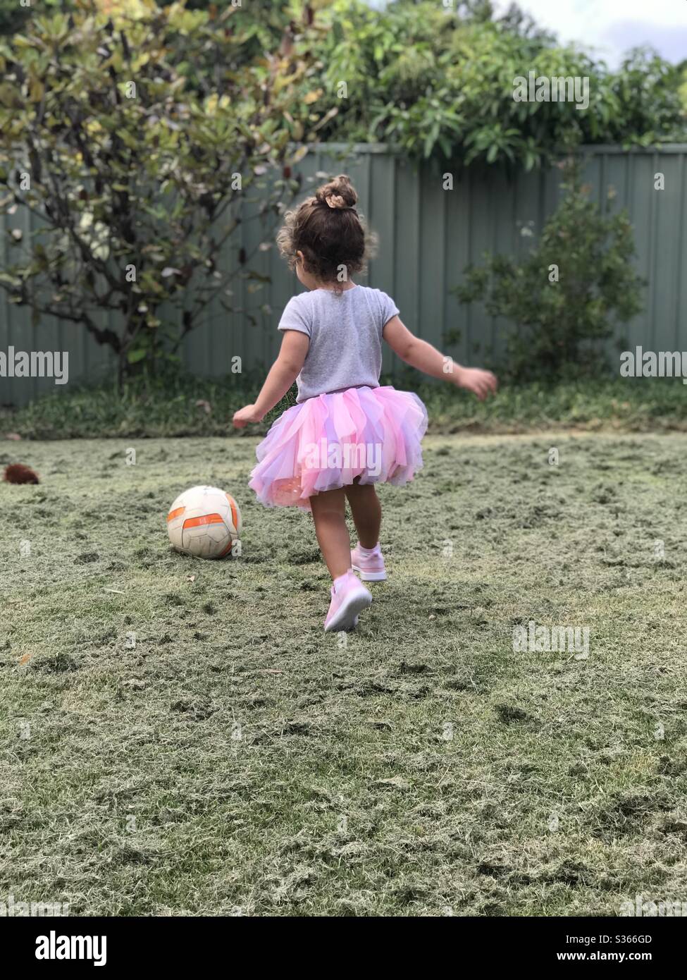 Girl Kicks The Ball High Resolution Stock Photography and Images - Alamy