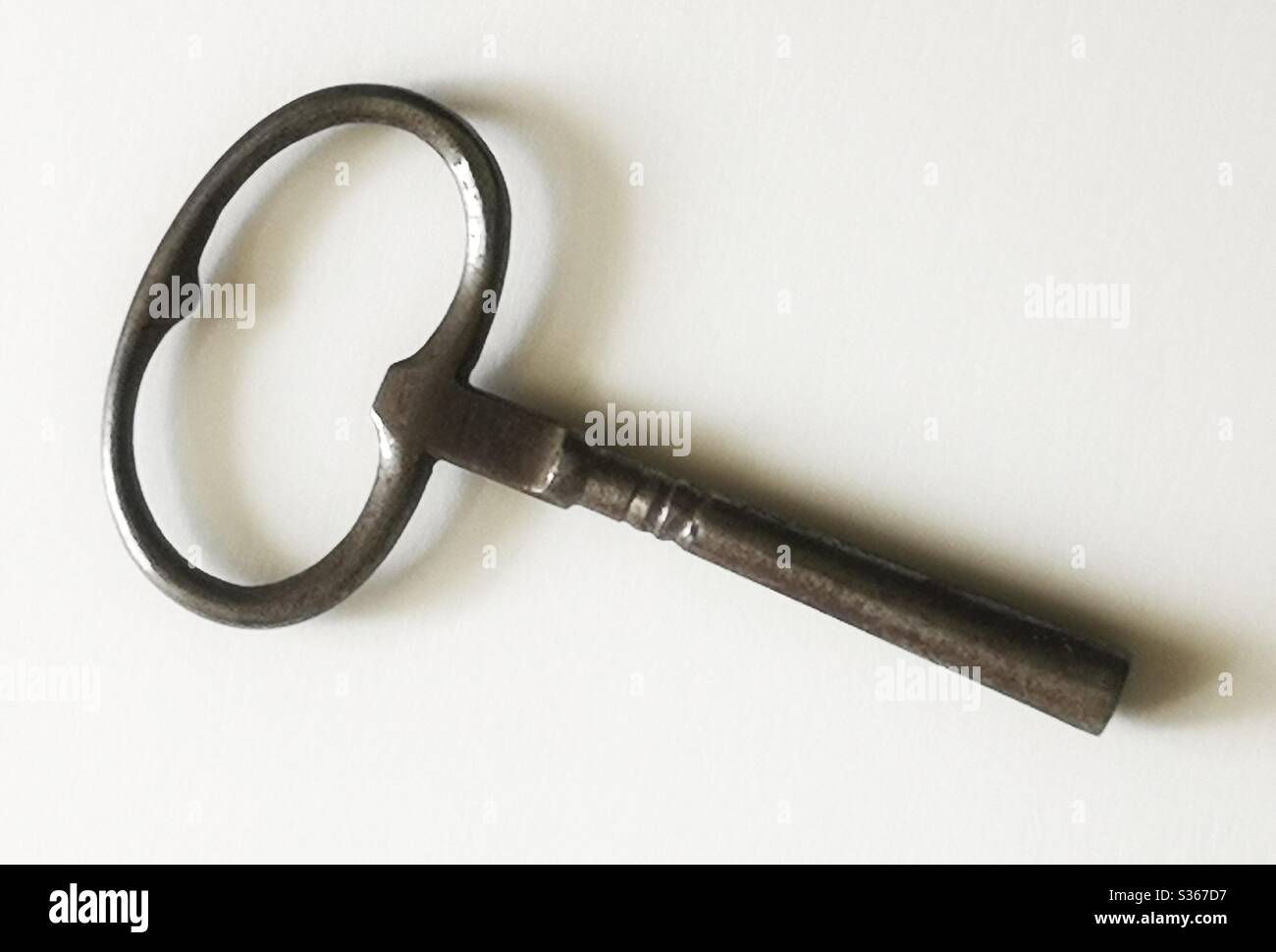 Old iron clock key Stock Photo - Alamy