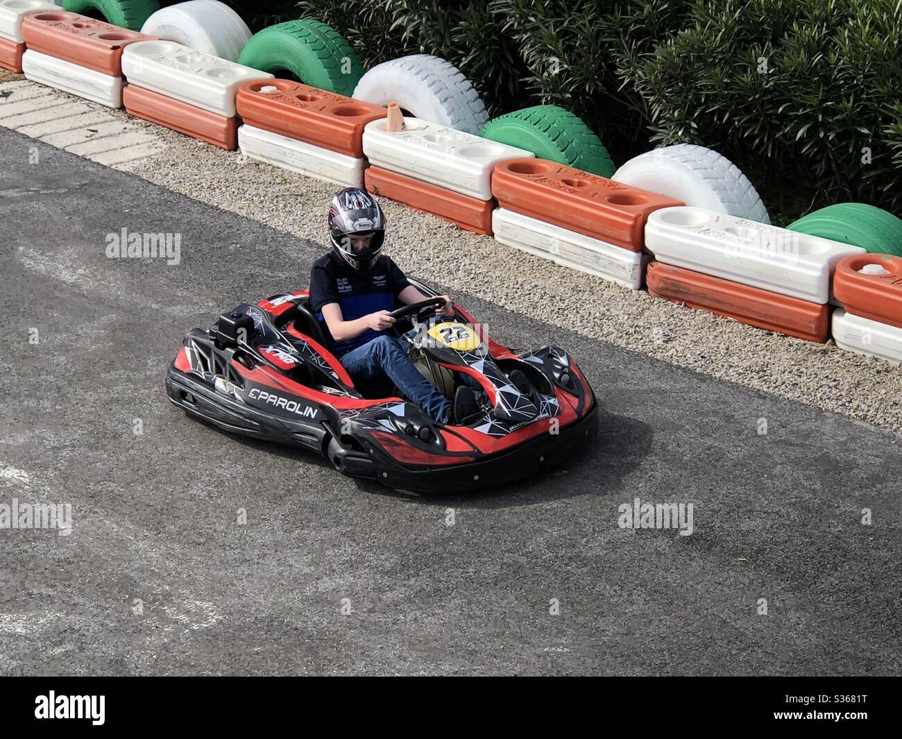 Teenager driving a Go Kart on an outdoor track Stock Photo - Alamy