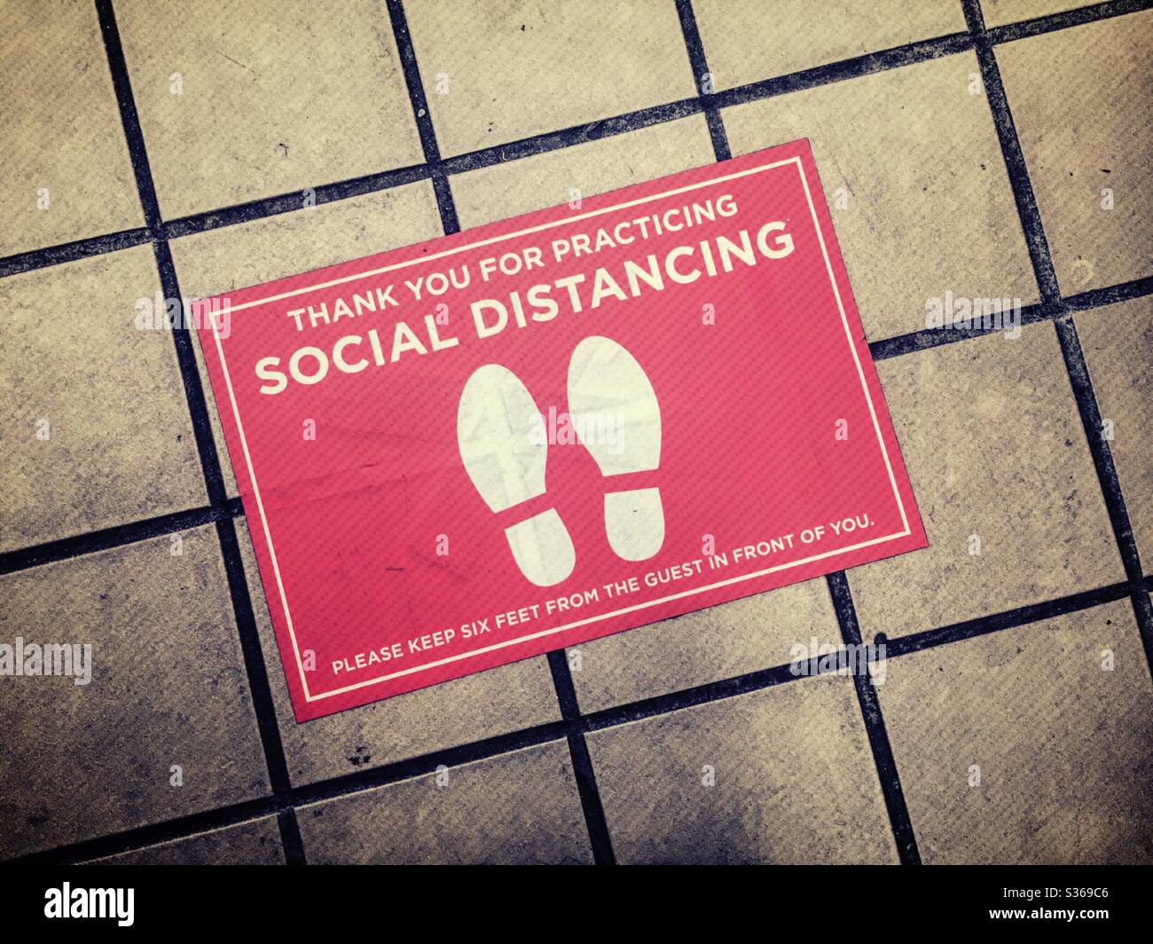 Social distancing foot print sign in a supermarket aisle, NYC, 2020 ...