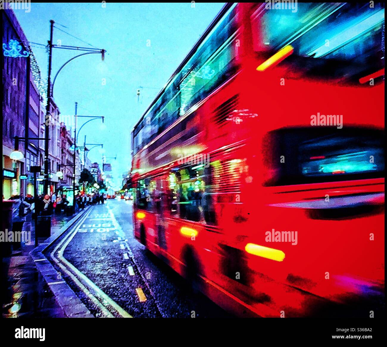 Red bus moving along Oxford street in London Stock Photo - Alamy