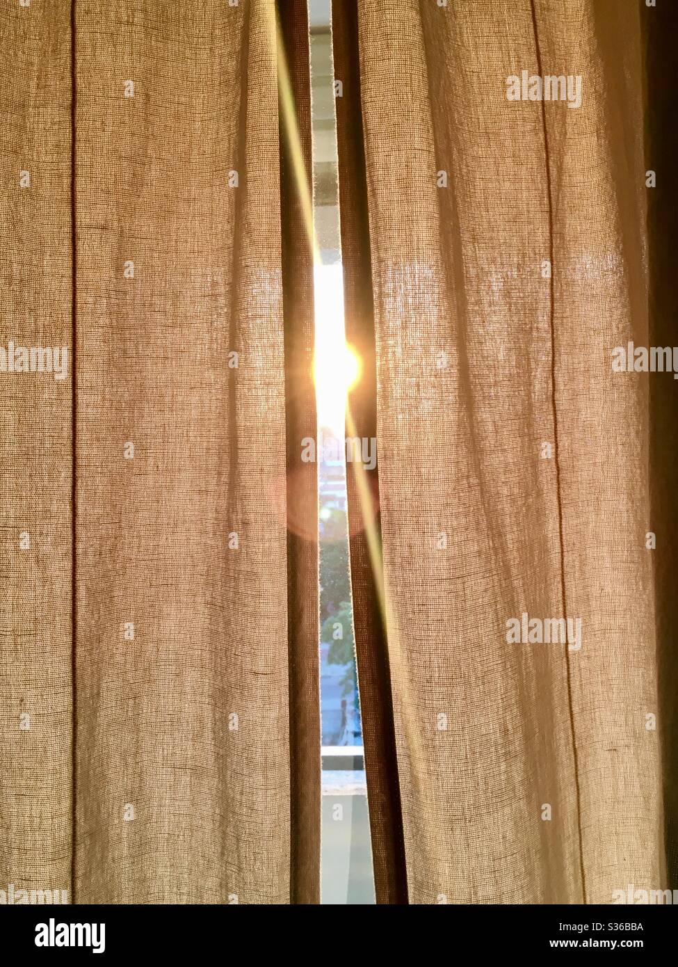Sun shining through curtain Stock Photo - Alamy