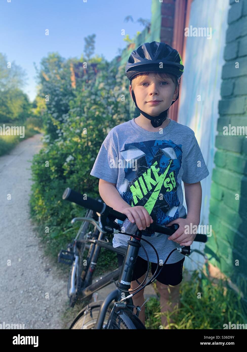 Portrait of a boy and his bike Stock Photo - Alamy