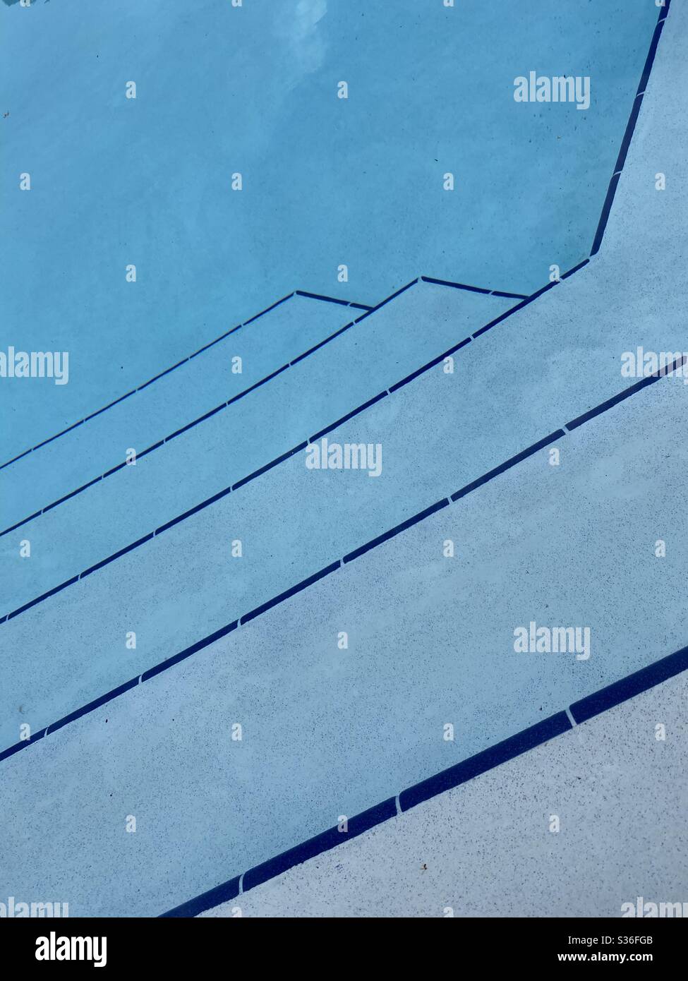 Background of steps into swimming pool water Stock Photo - Alamy