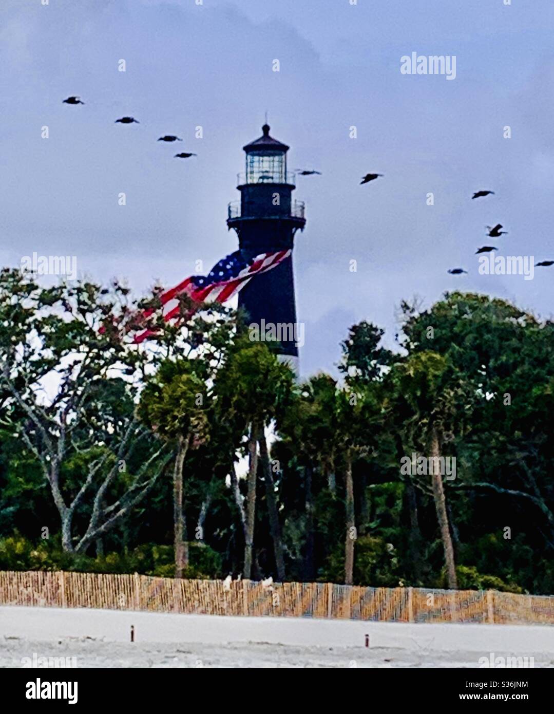 American flag flying around hi-res stock photography and images - Alamy