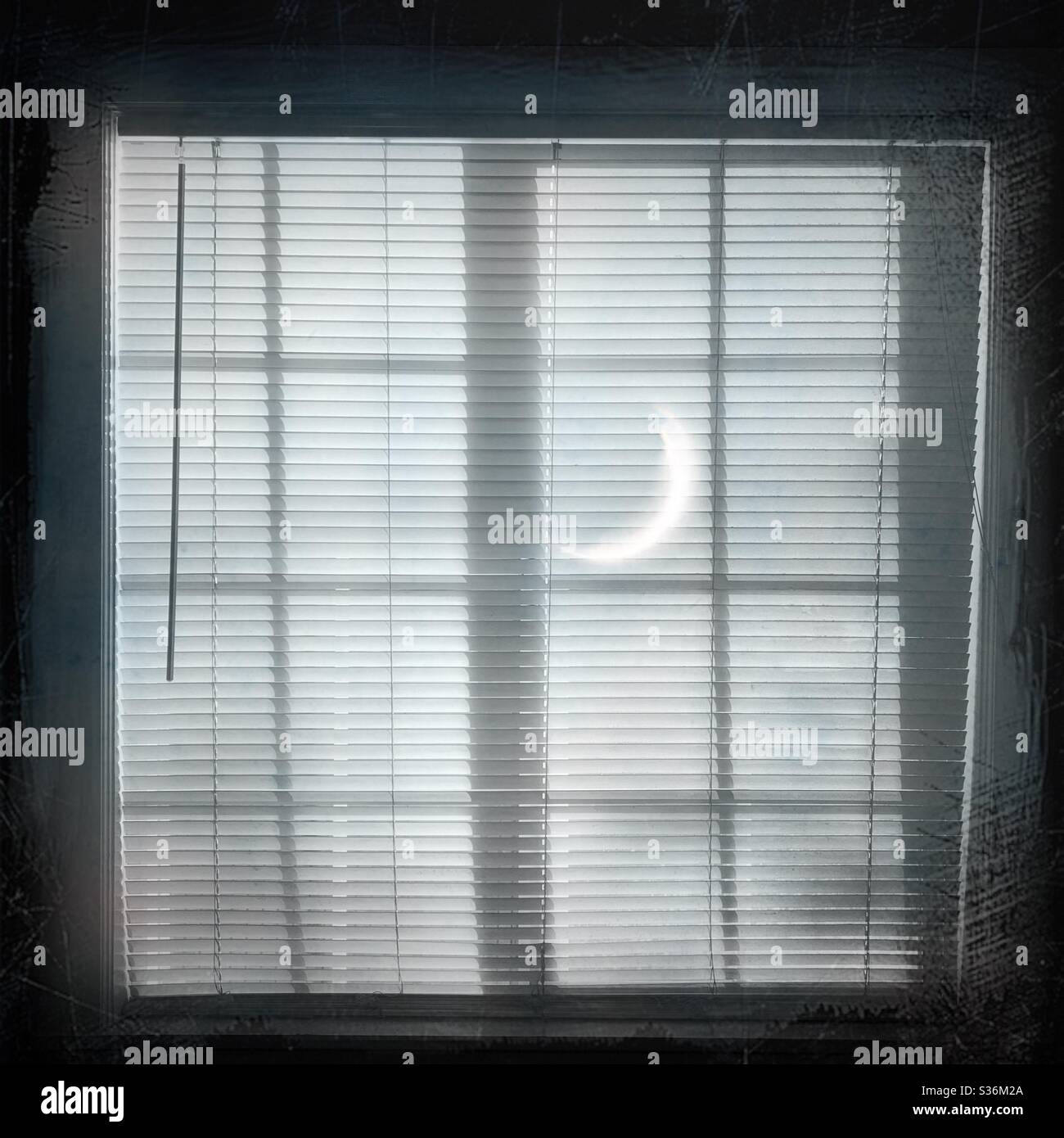 One half moon shaped shown outside the square home window in light cyan ...