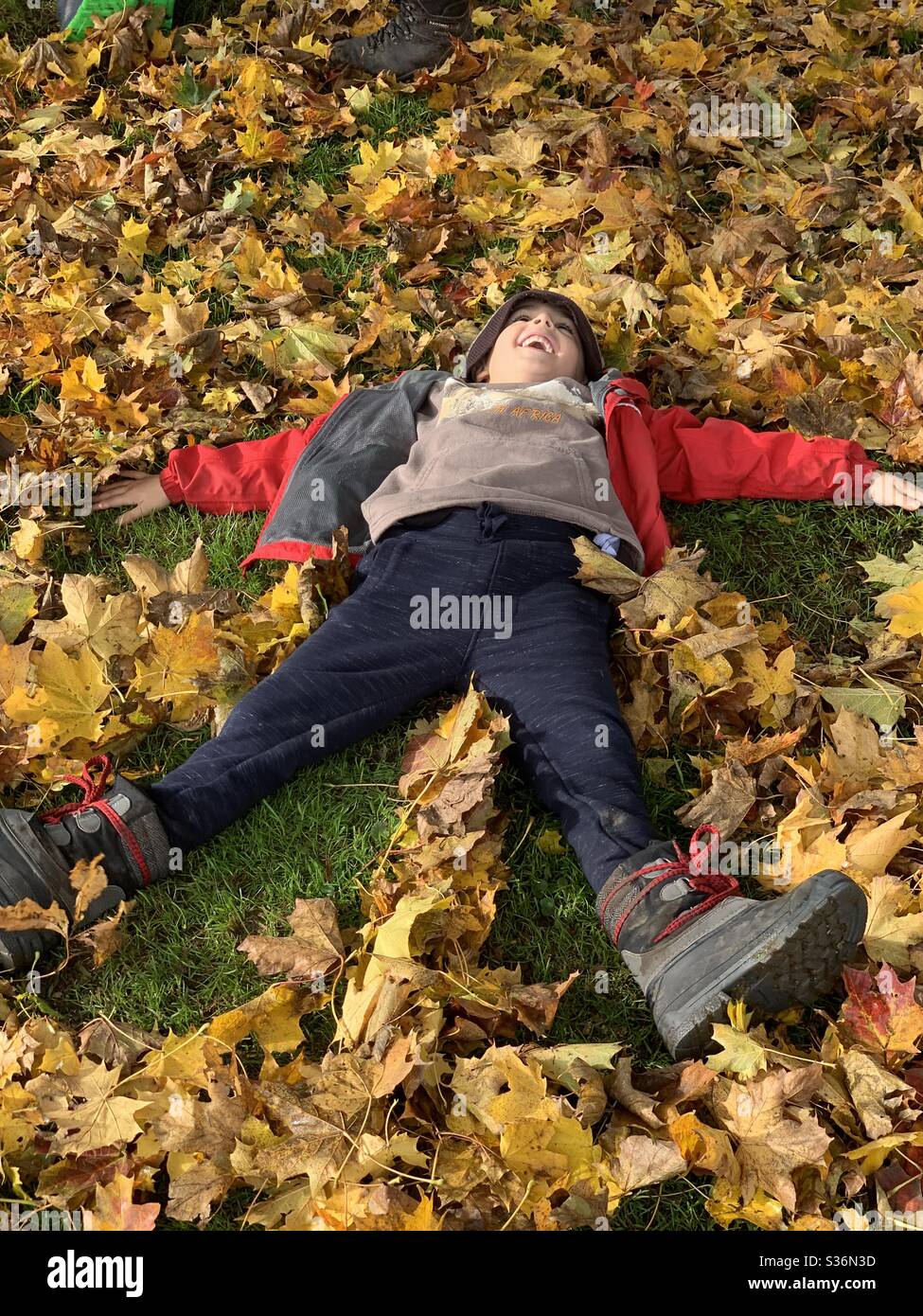 Autumn leaves child angels Stock Photo - Alamy