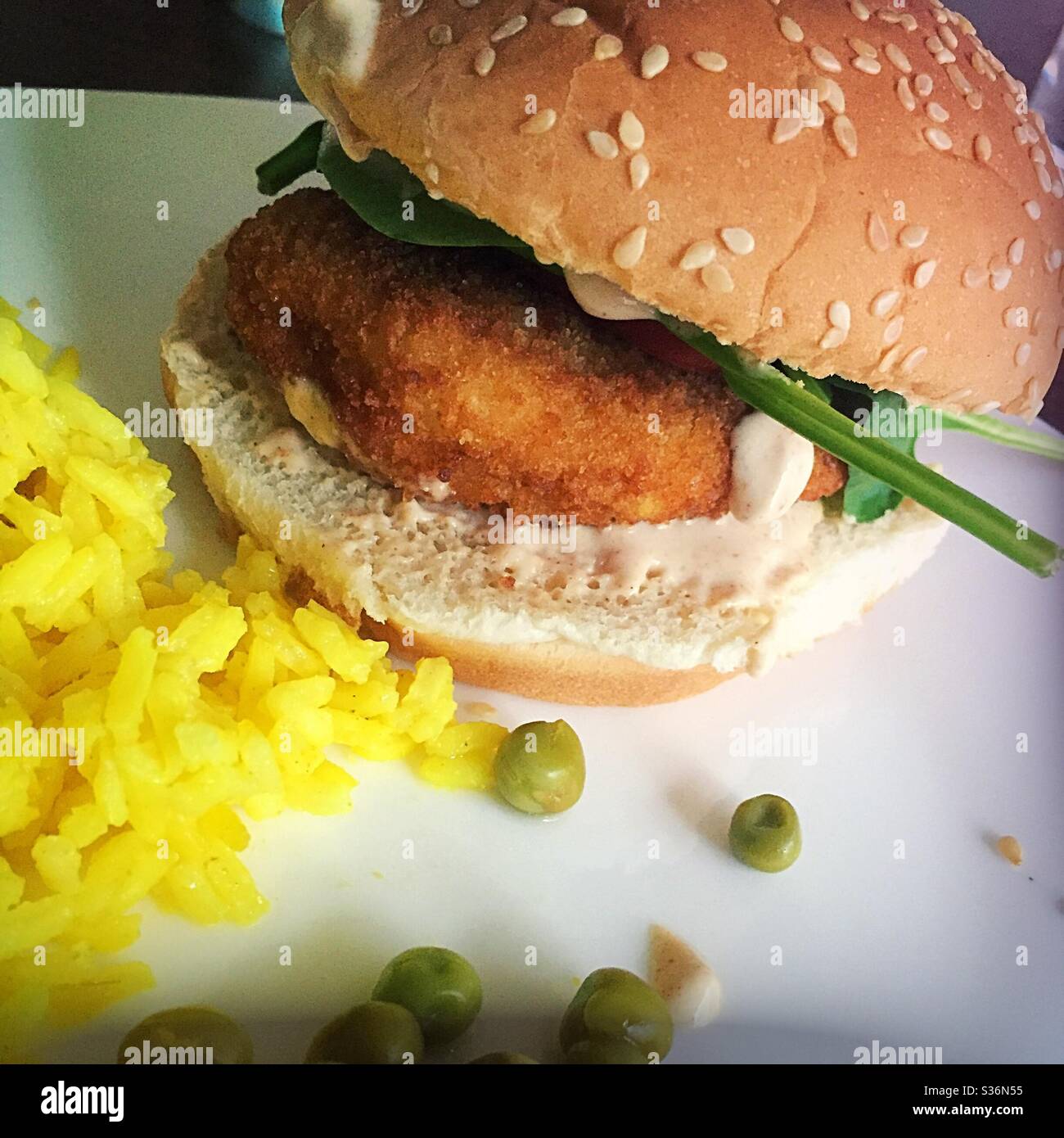 Close up of a chicken cutlet sandwich as part of a balanced meal of ...