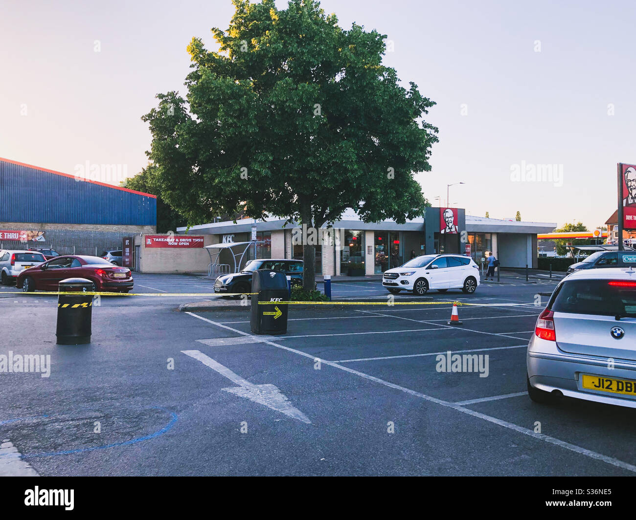Cars queue for the drive thru at a KFC fast food restaurant during the ...