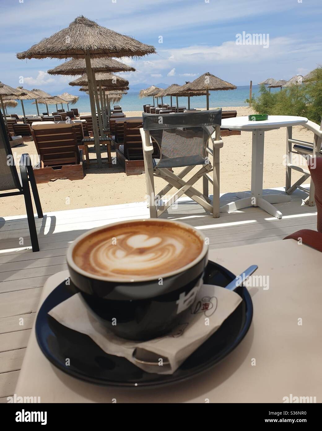 Relaxing coffee at the beach Stock Photo - Alamy