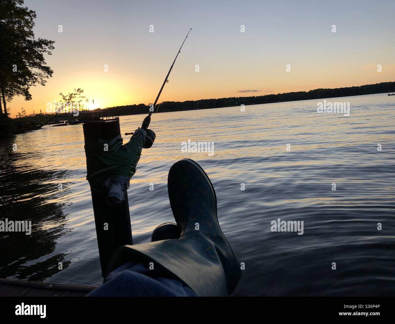 Fishing rod in rod holder hi-res stock photography and images - Alamy