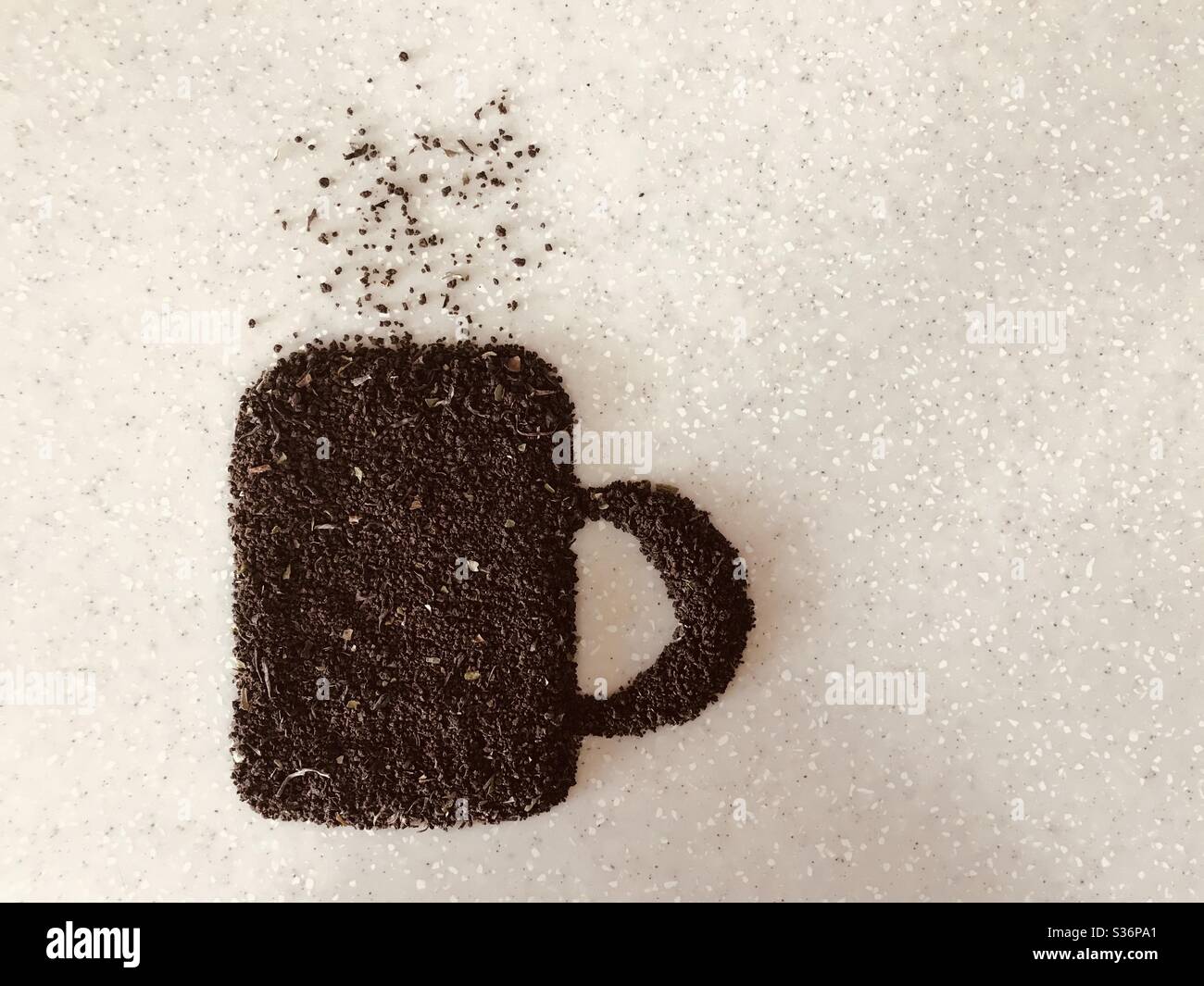 Tea dust granules shaped to resemble a cup -cup of Tea / coffee with ...
