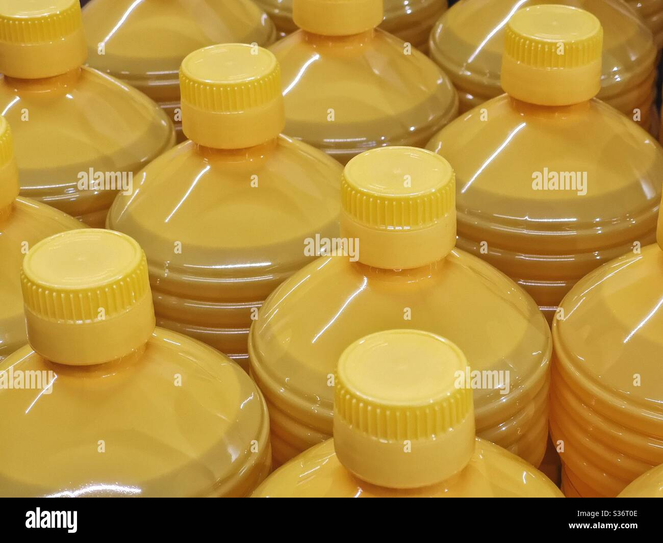 Yellow plastic bottles Stock Photo - Alamy