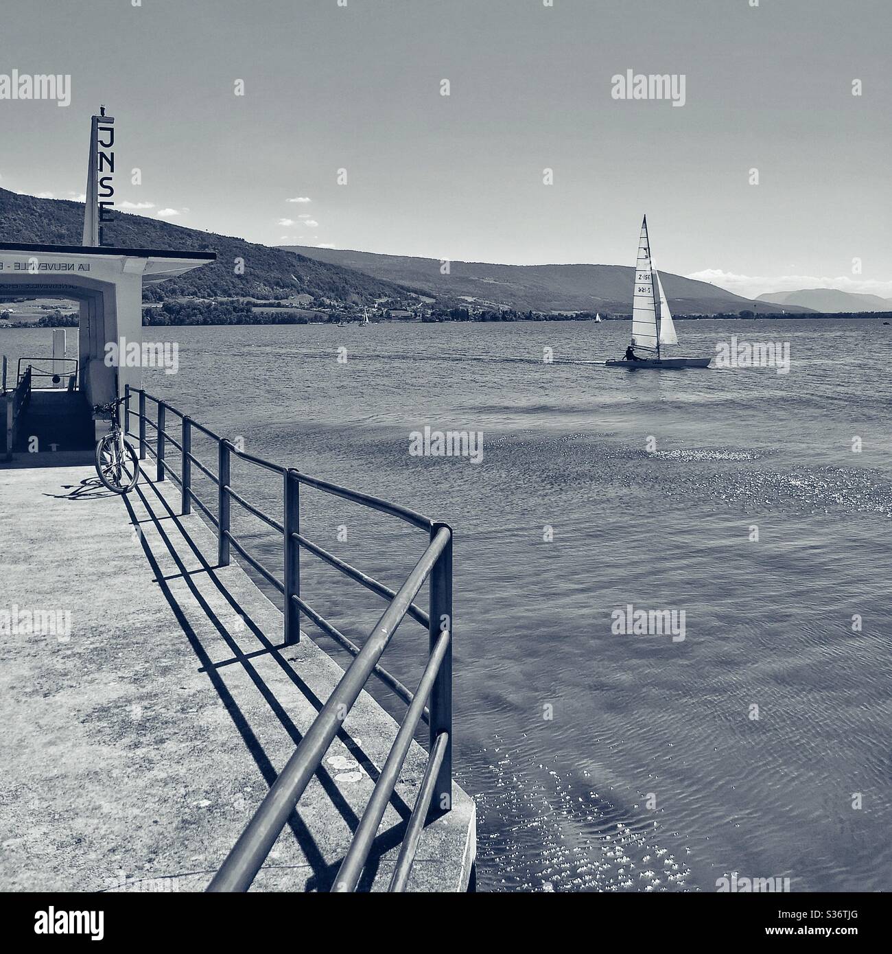 Sailing boat and pier, Lake Bienne, Switzerland Stock Photo - Alamy