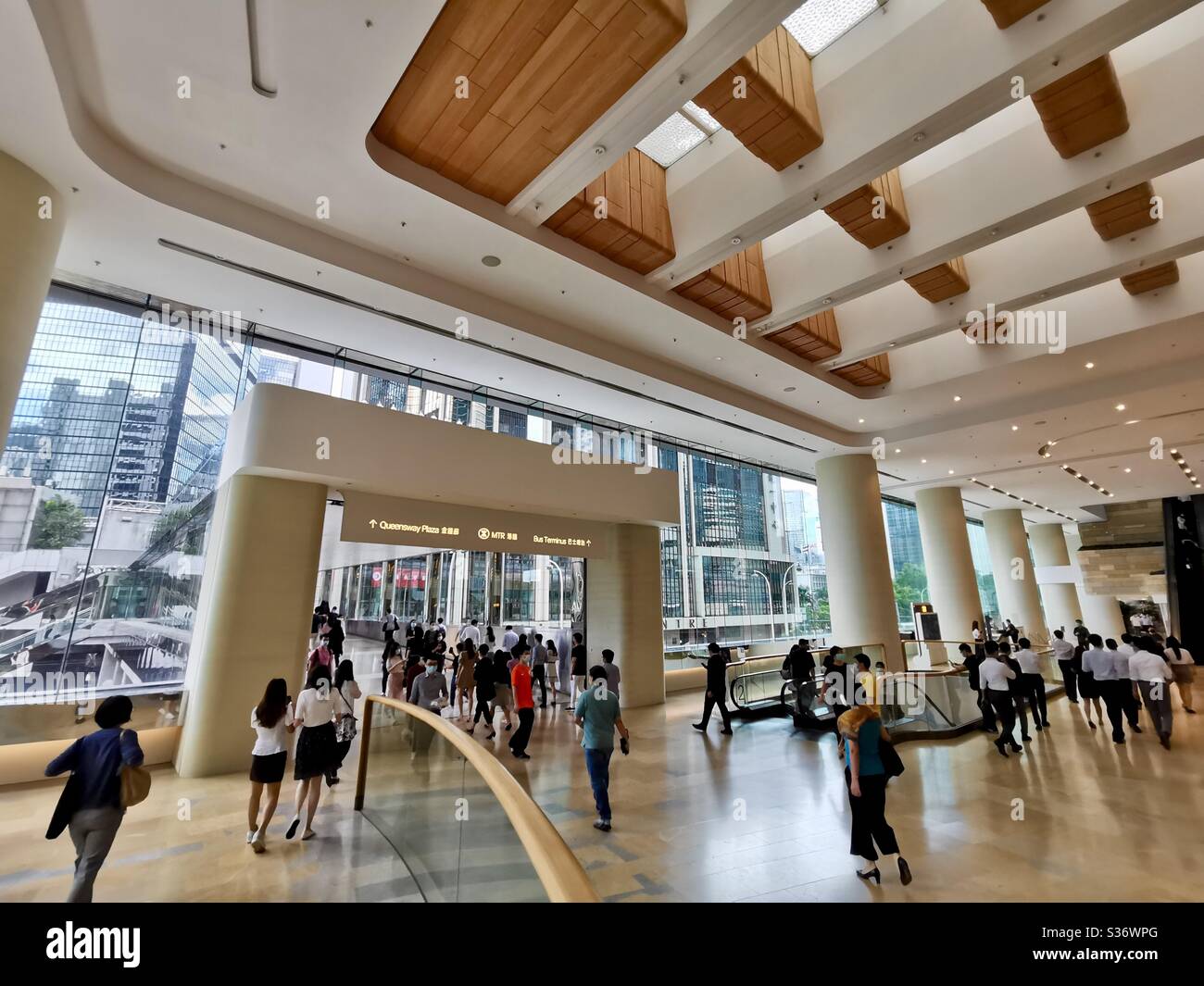 Hongkongers entering the Pacific place shopping mall from the ... Hongkongers entering the Pacific place shopping mall from the ...