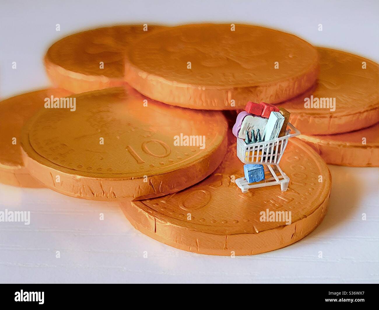 Price of shopping. Shopping trolley or cart on money coin. Inflation ...
