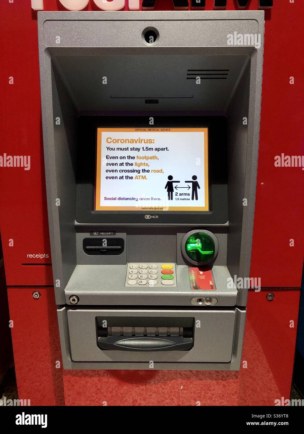 An ATM with Covid19 coronavirus warnings on its screen in Darwin ...