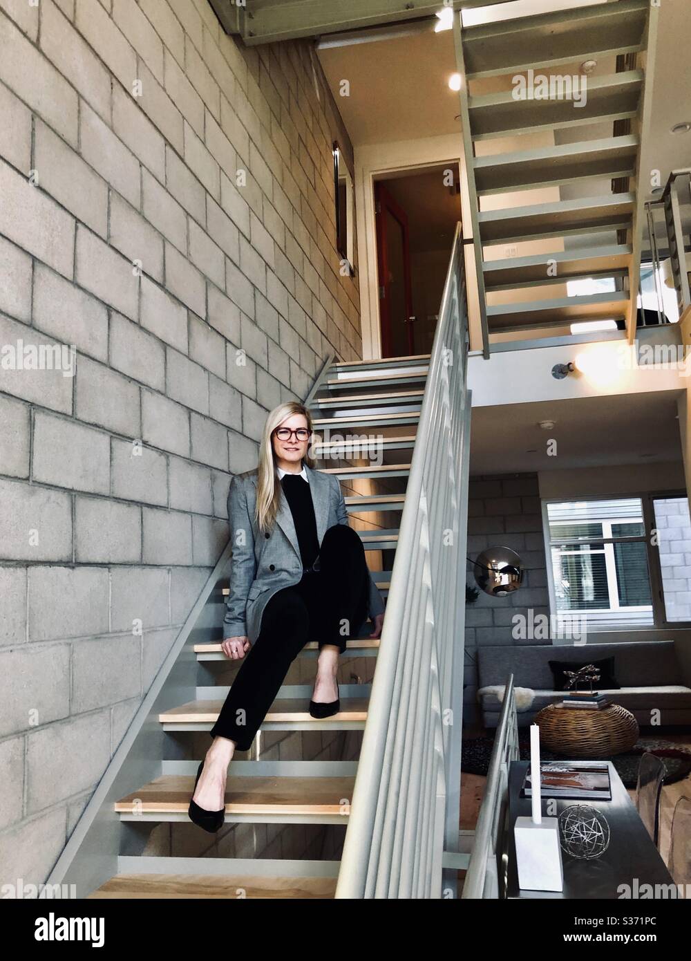 Woman climbing stairs loft hi-res stock photography and images - Alamy