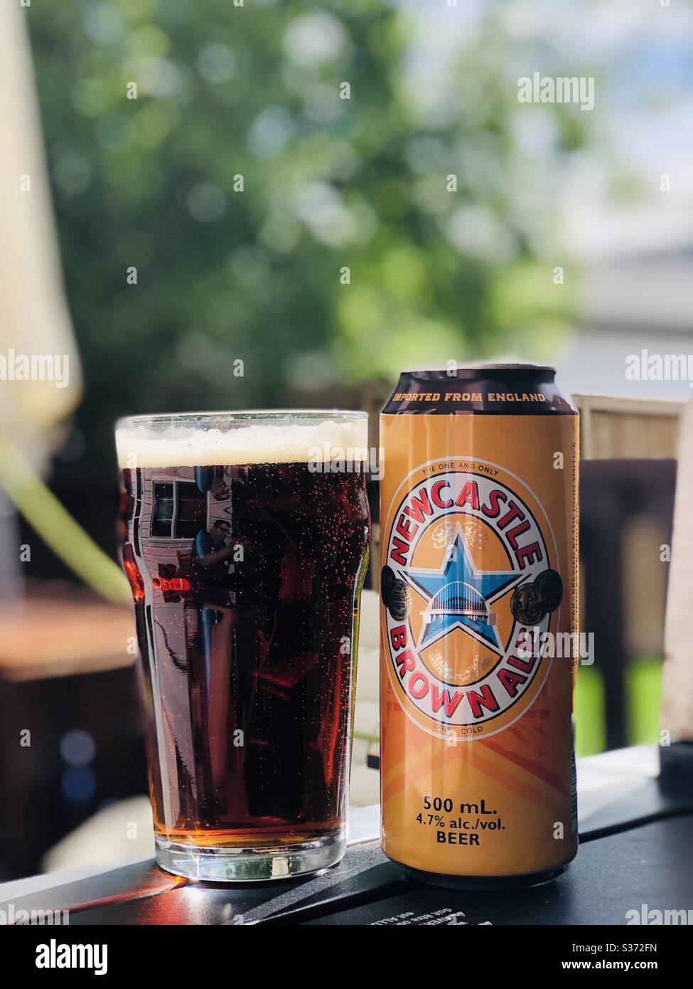 Next to a pint of beer hi-res stock photography and images - Alamy