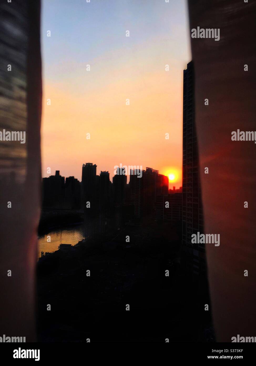 Home and sunset by the window Stock Photo - Alamy