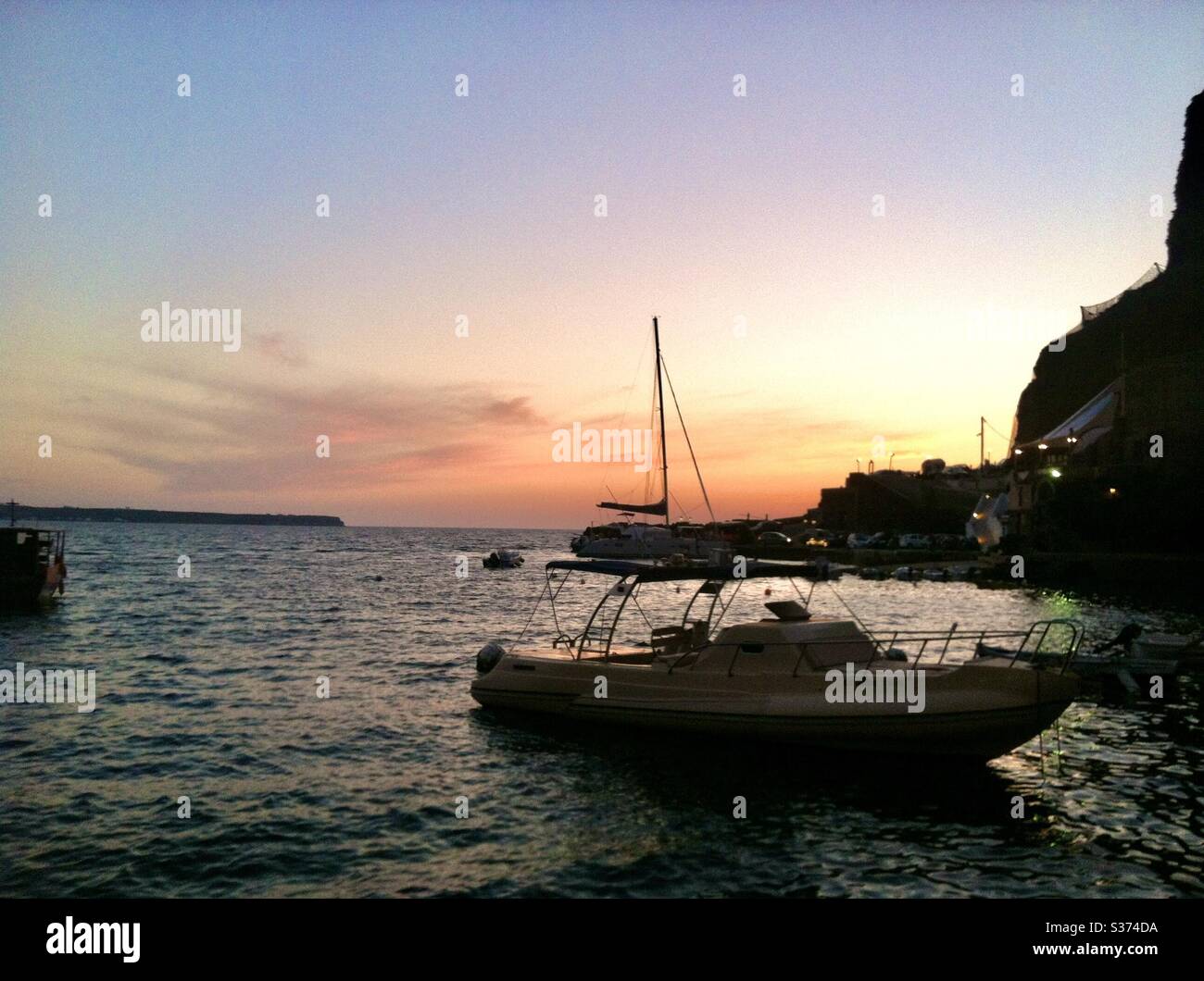 Santorini sunset boat hi-res stock photography and images - Alamy