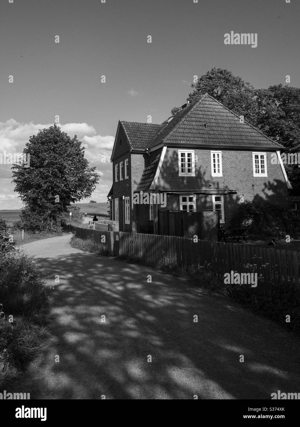 Shadows falling dramatically on a beach house near Baltic Sea, Germany ...