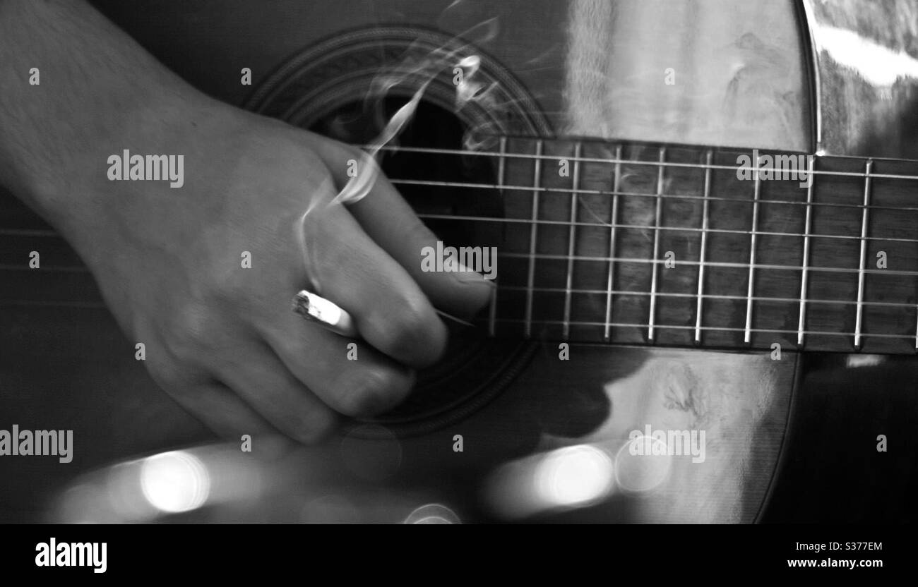 Playing guitar while smoking hi-res stock photography and images - Alamy