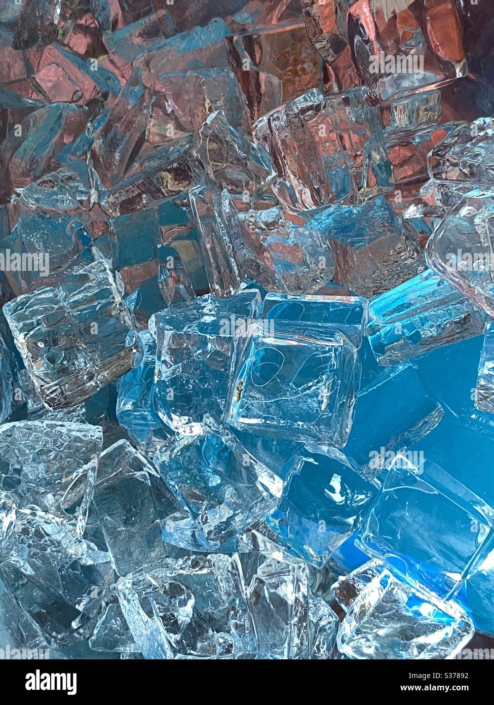 Abstract background of ice cubes reflecting aqua and rose colors Stock ...