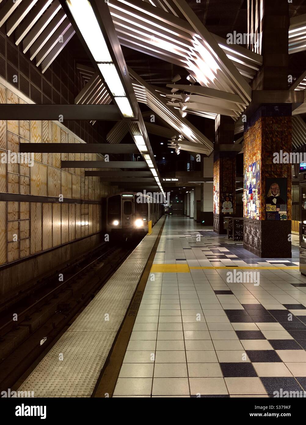 Metro subway train approaches the platform at the Universal Studios ...