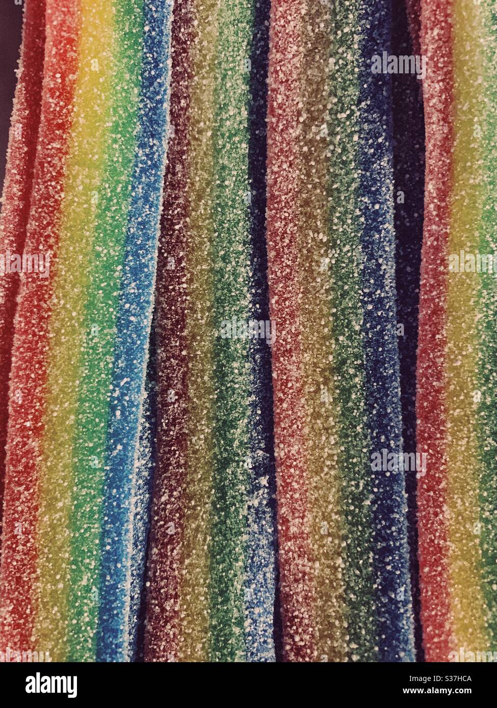 Rainbow fizzy strip Stock Photo - Alamy