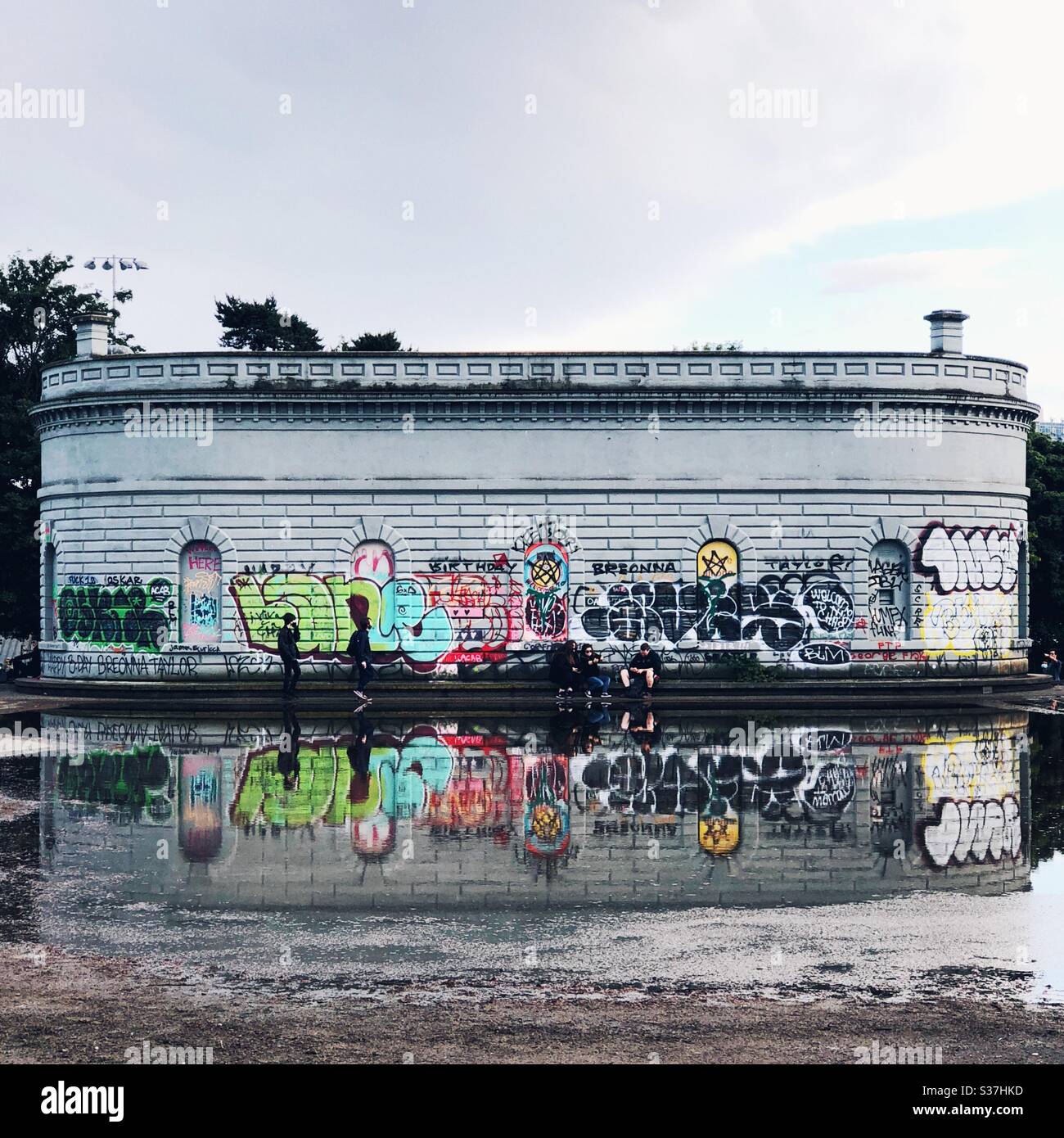 People walking and sitting at Old Pumphouse at Cal Andreson Park in ...