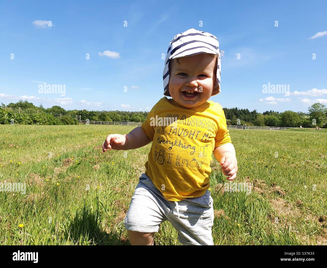 Happy country baby Stock Photo - Alamy