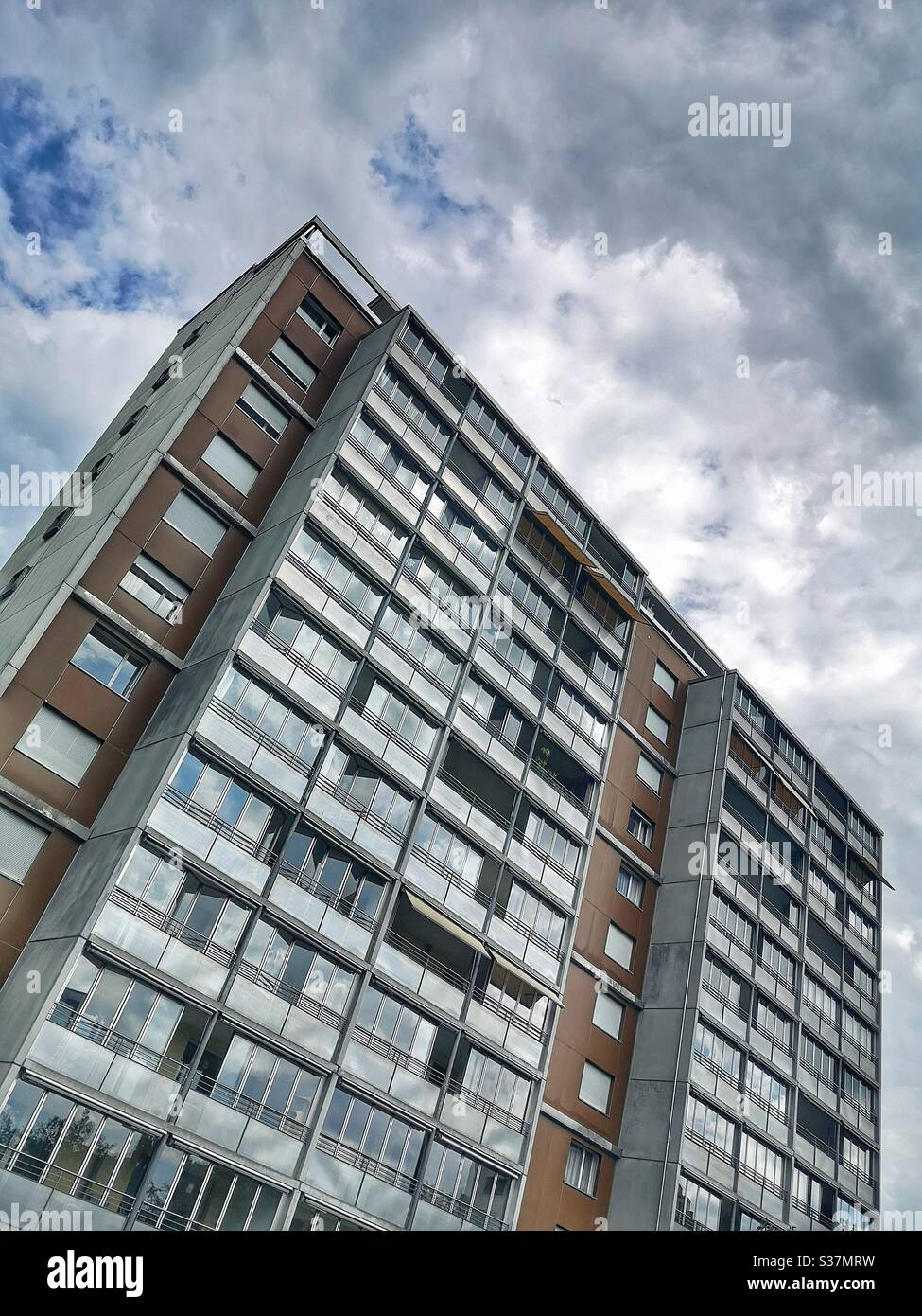 1960s residential tower block against cloudy sky Stock Photo - Alamy