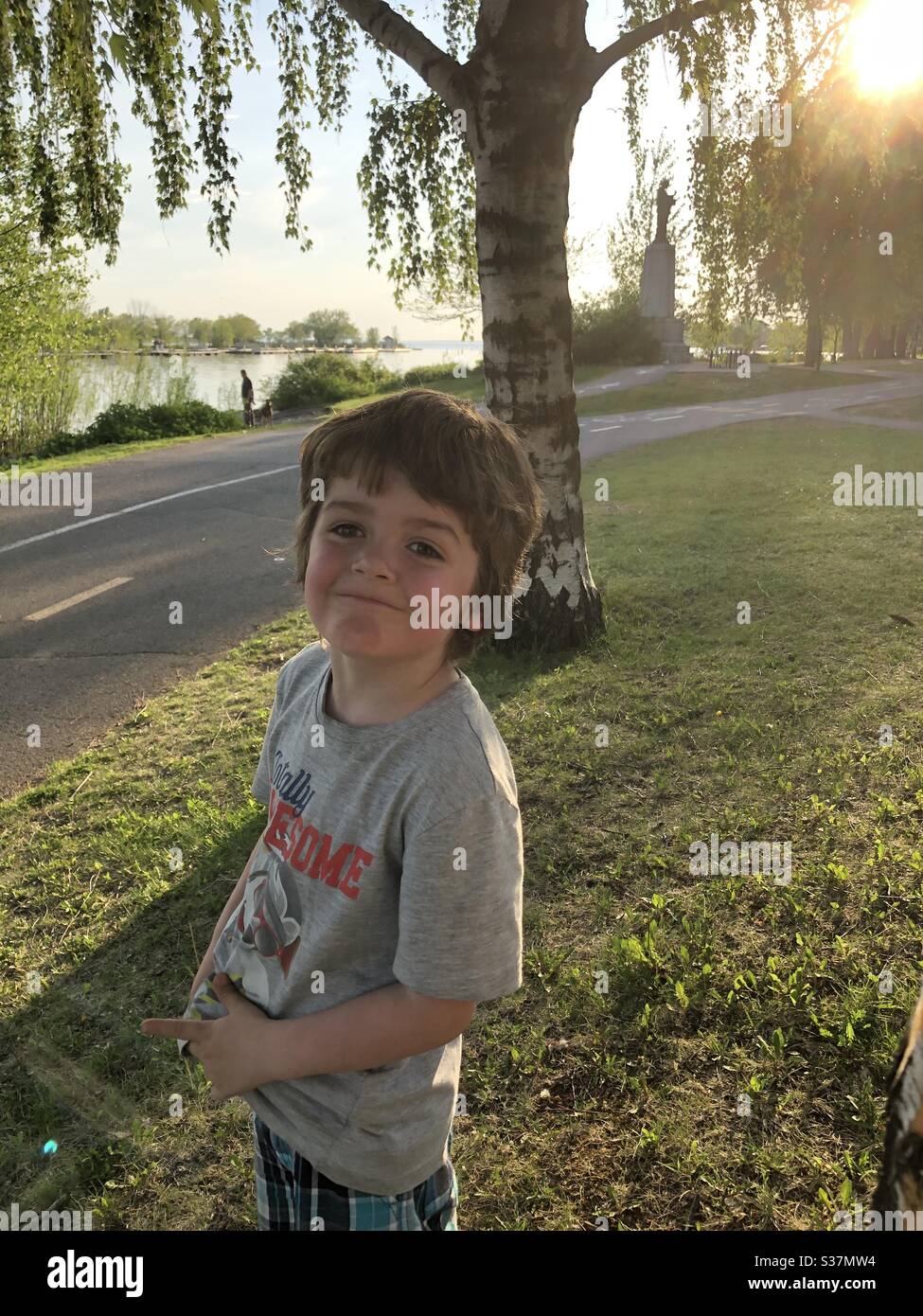 Boy outside and smiling hi-res stock photography and images - Alamy