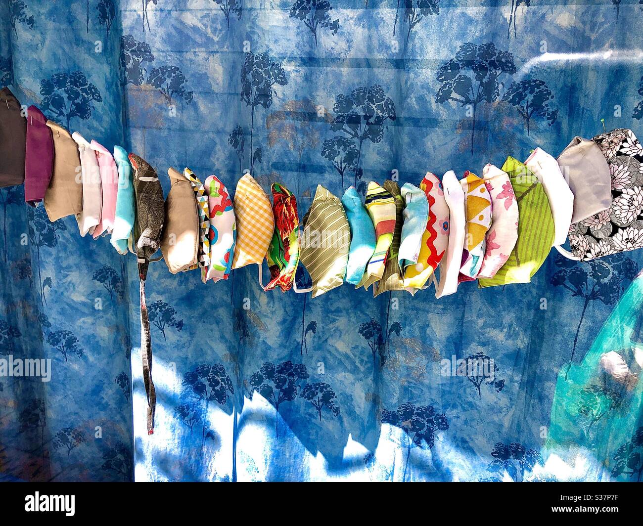 Window display of hand-made face masks for protection against Covid-19 ...