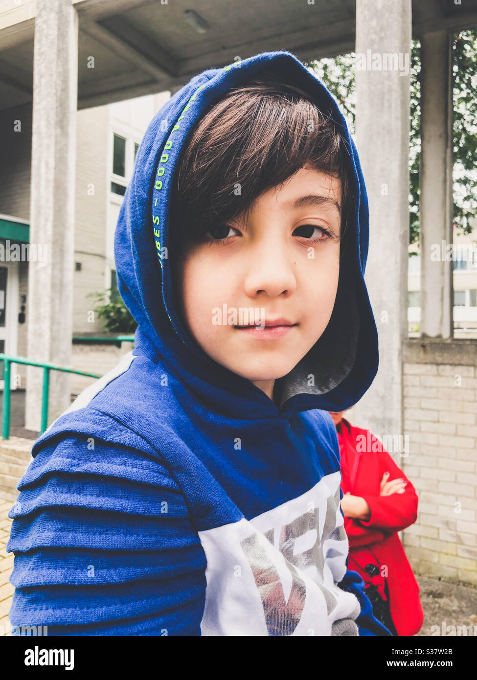 A portrait of a young boy wearing a hoodie Stock Photo - Alamy
