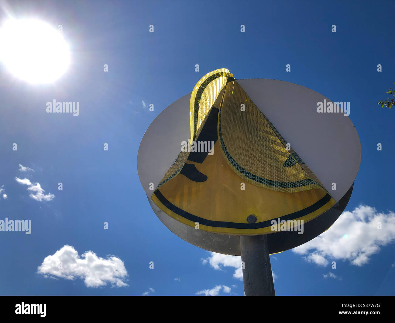 Road sign melting under the hot sun Stock Photo - Alamy