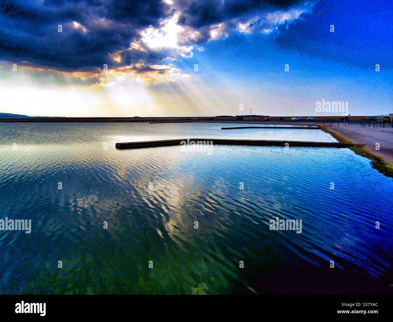 Sun reflection on lake Stock Photo - Alamy