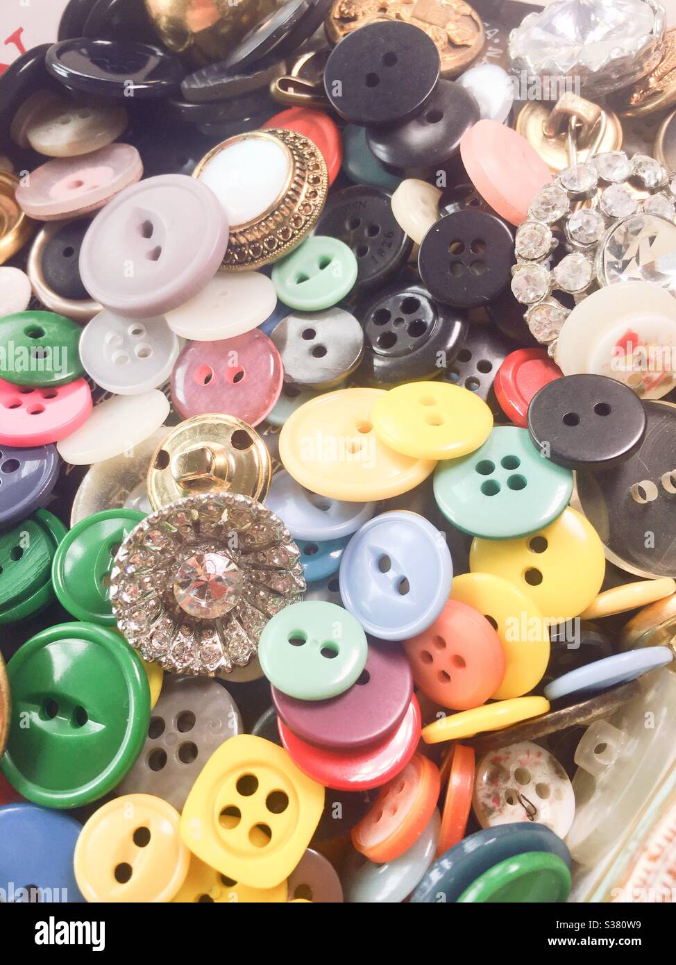 Vintage buttons in various colors are used in do it yourself sewing ...