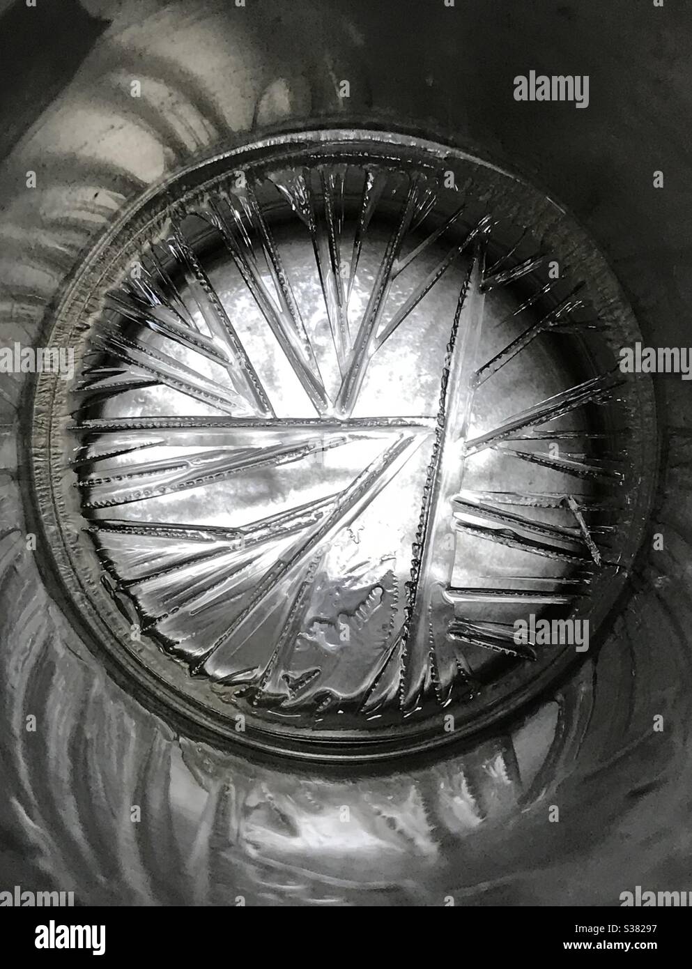Ice at the bottom of a stainless steel glass hi-res stock photography ...