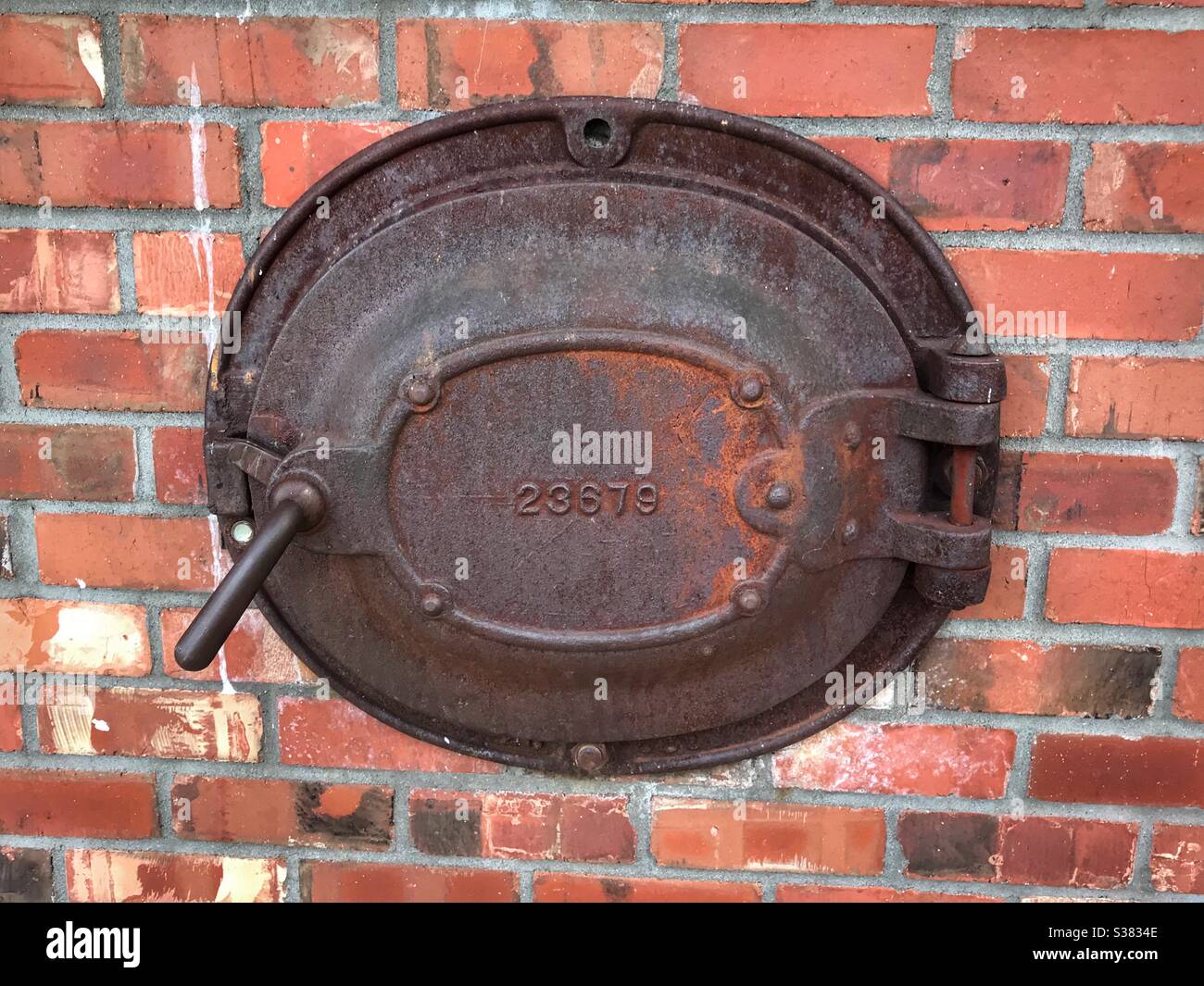 Old rusty boiler door Stock Photo - Alamy