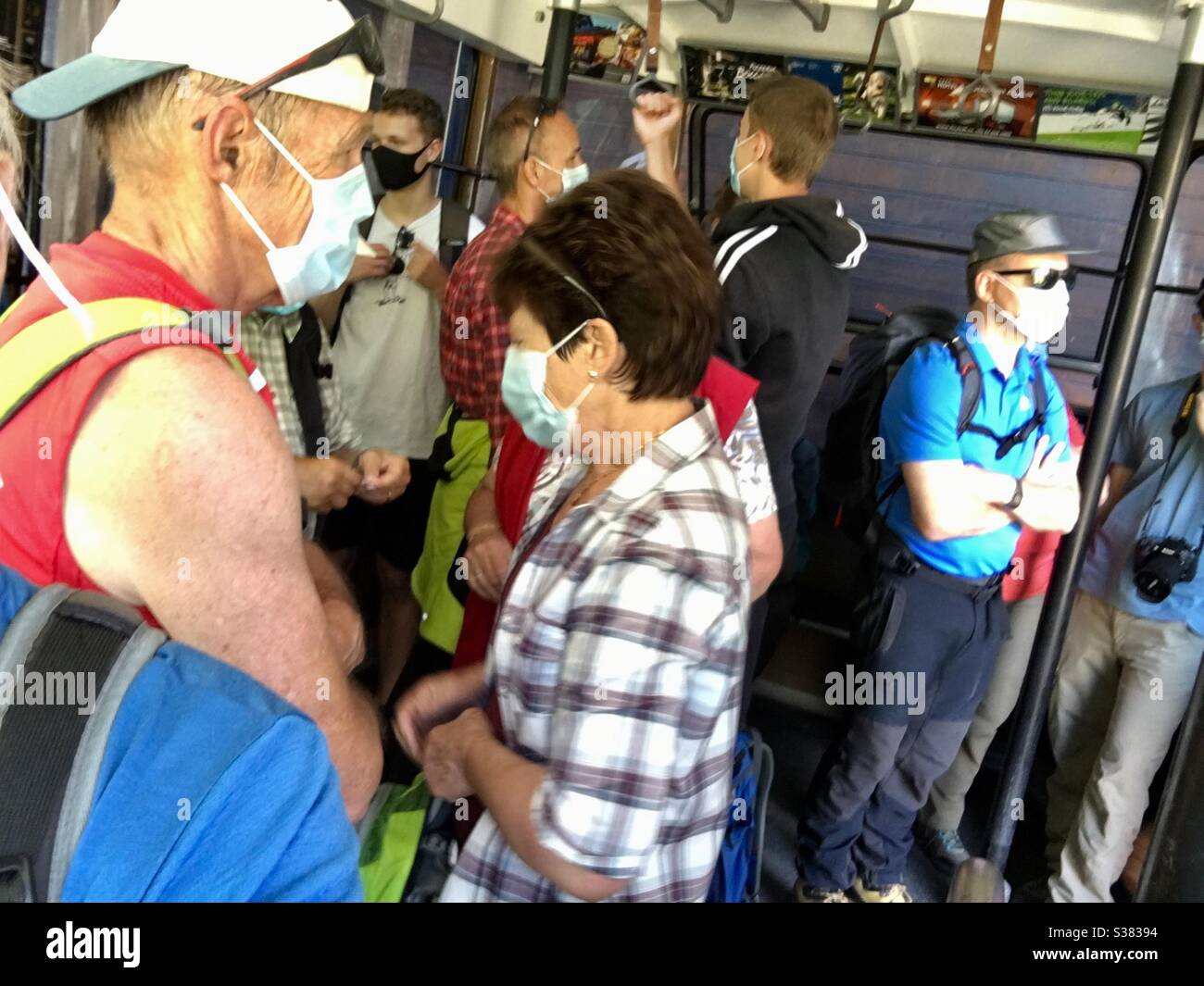 Passengers in Bus of public transportation wearing face masks during ...