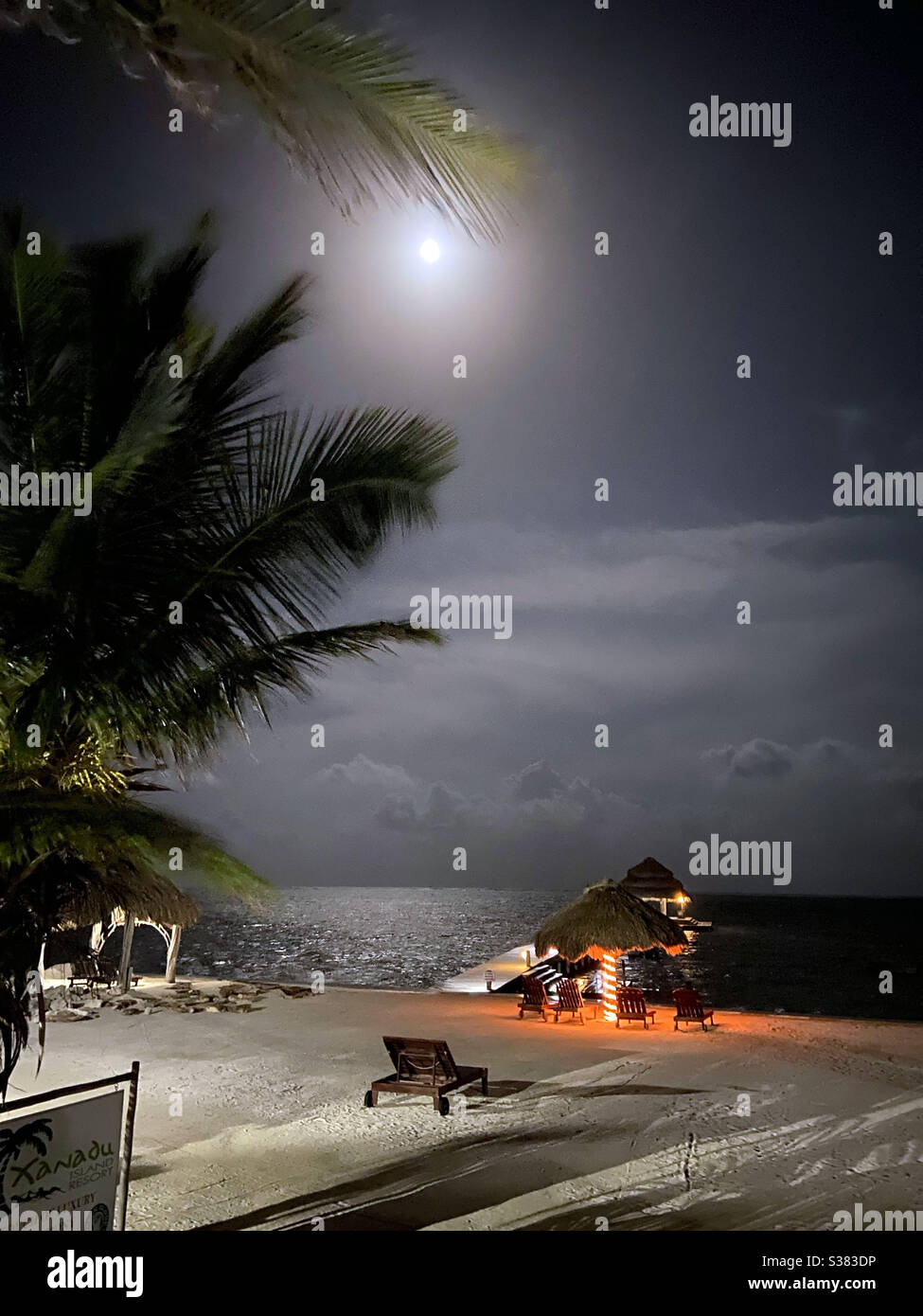 View of the Caribbean Sea and moon from Xanadu Resort at night in San ...