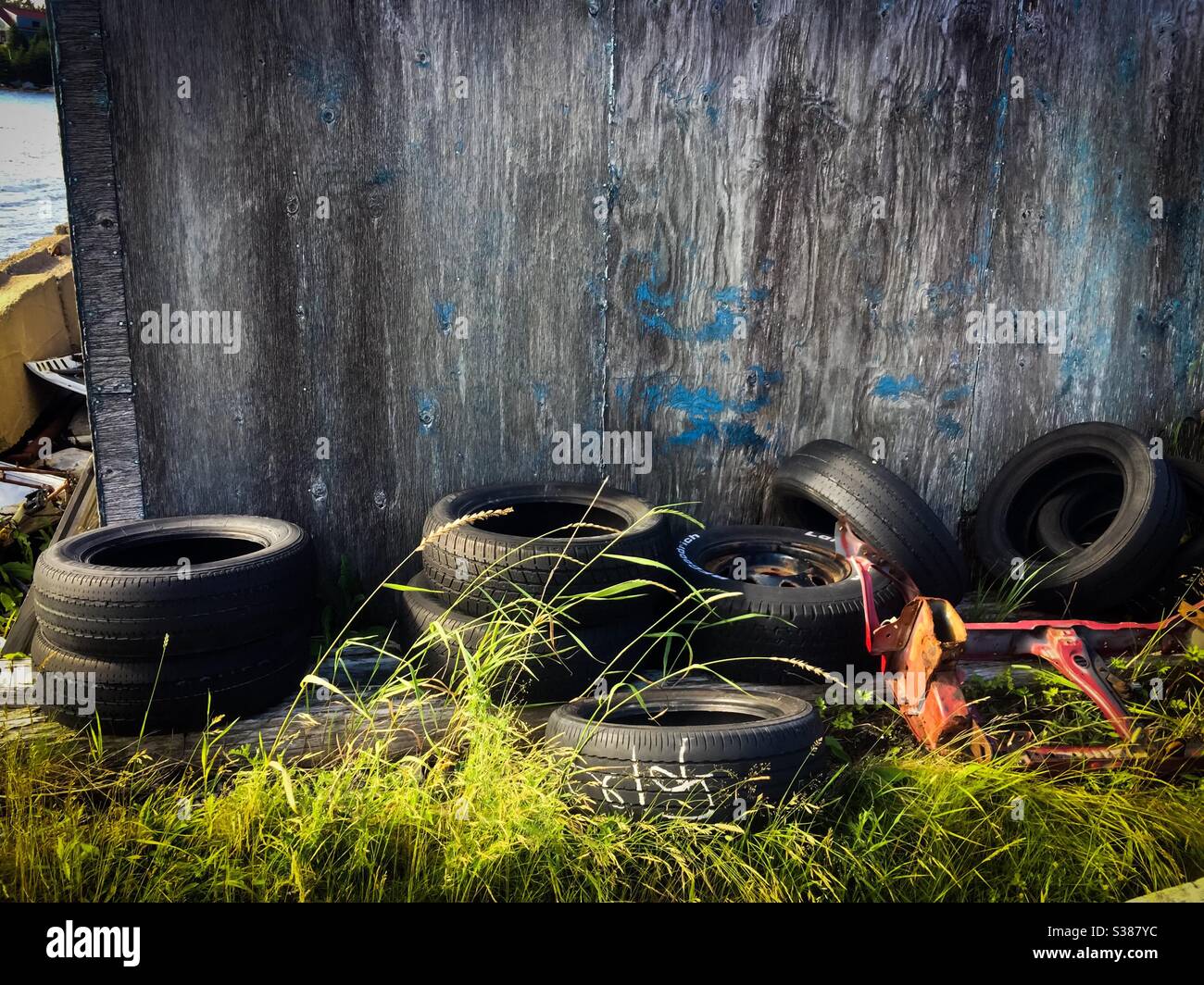 Discarded tires. Urban pollution Stock Photo - Alamy